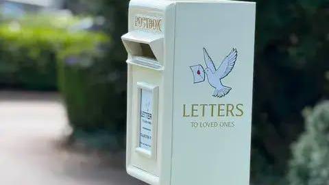 White postbox for letters of grieving families - AOL